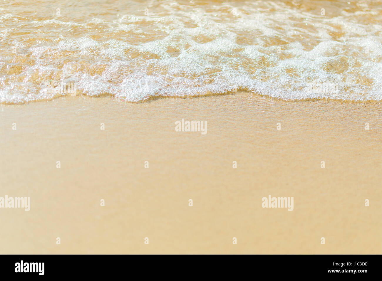 Sand beach with buble of sea Stock Photo - Alamy