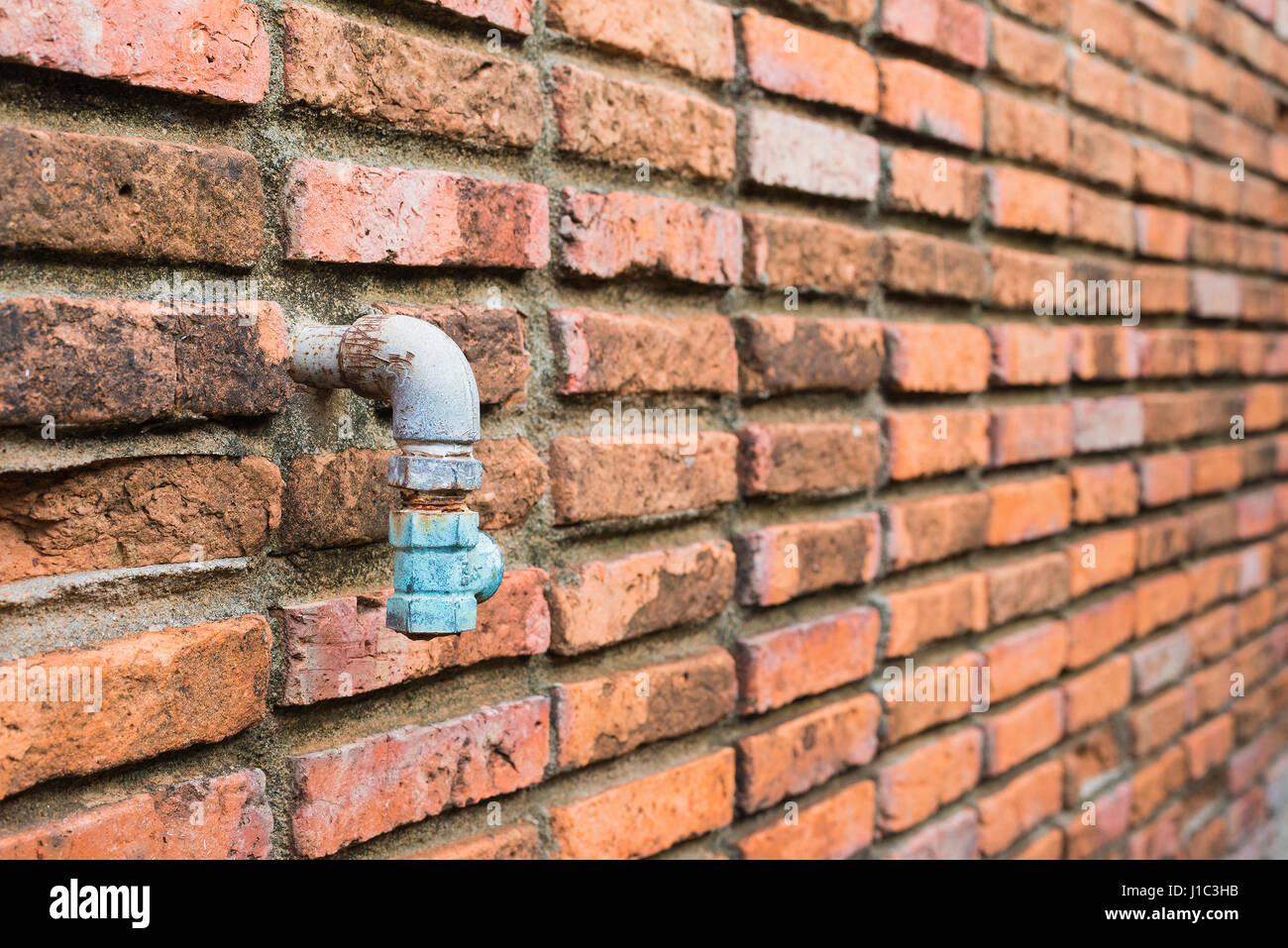 water tap with brick wall Stock Photo - Alamy