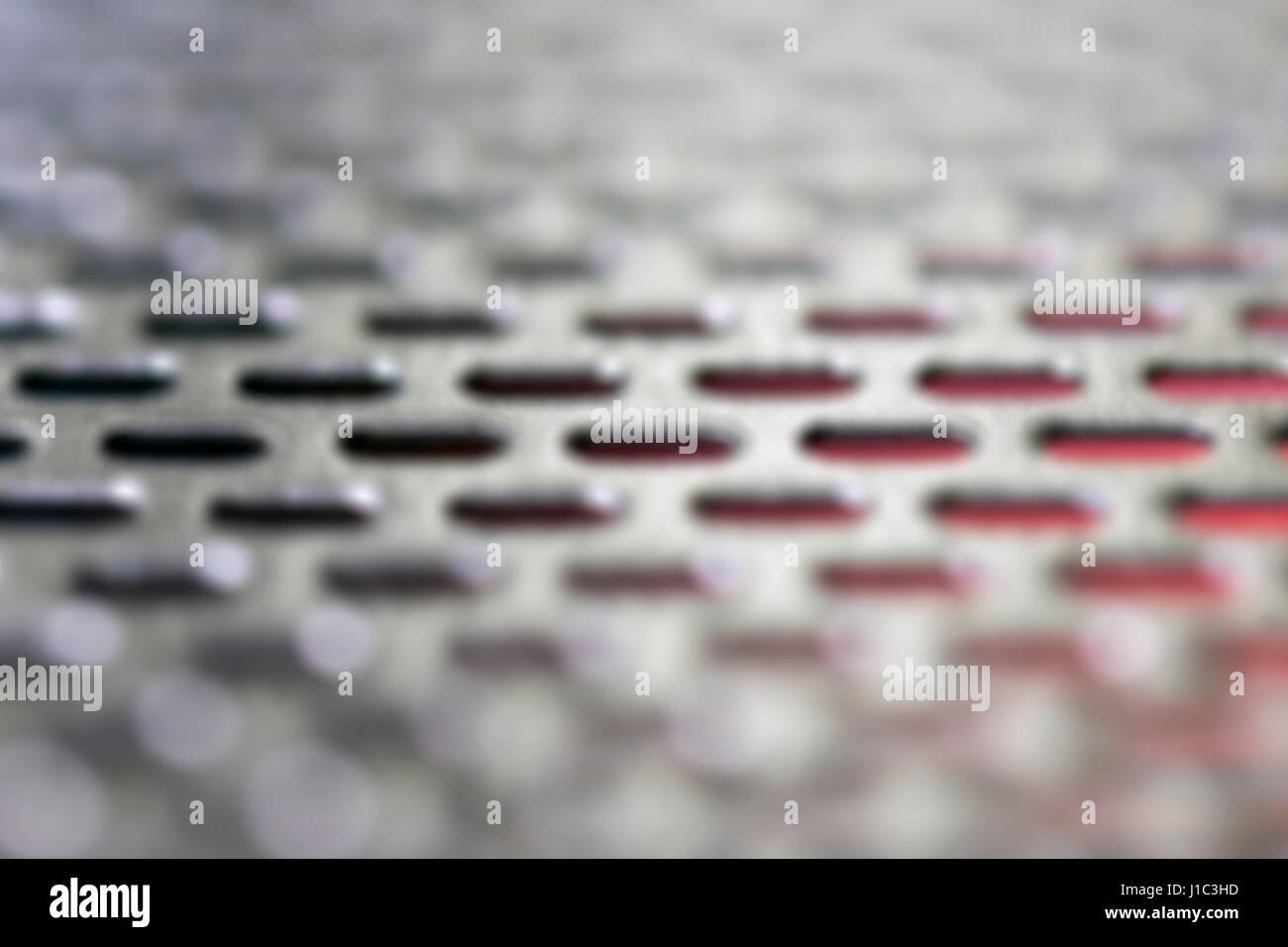 Metal hole pattern Stock Photo - Alamy