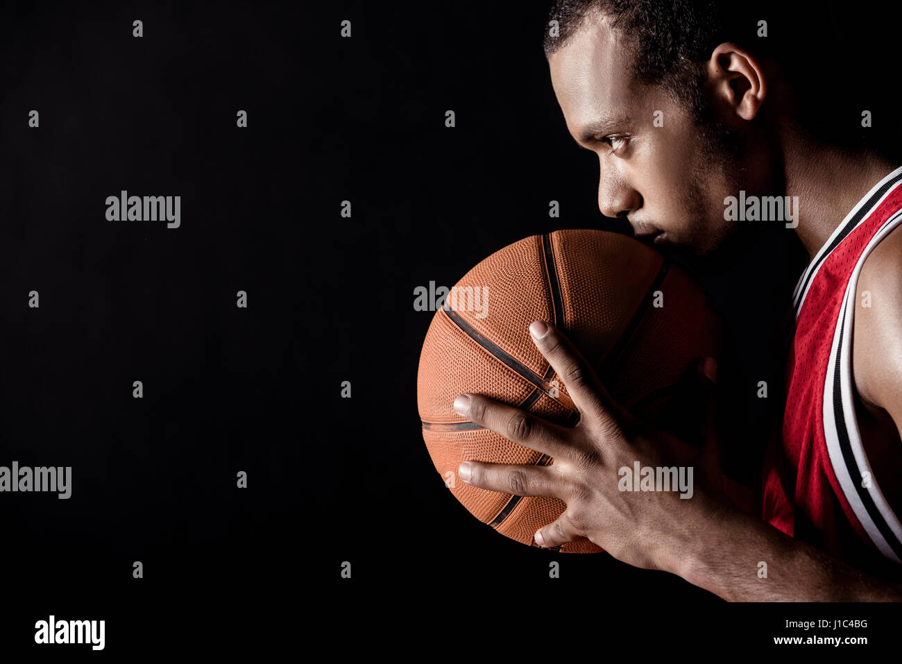 Side view man holding basketball hi-res stock photography and images ...
