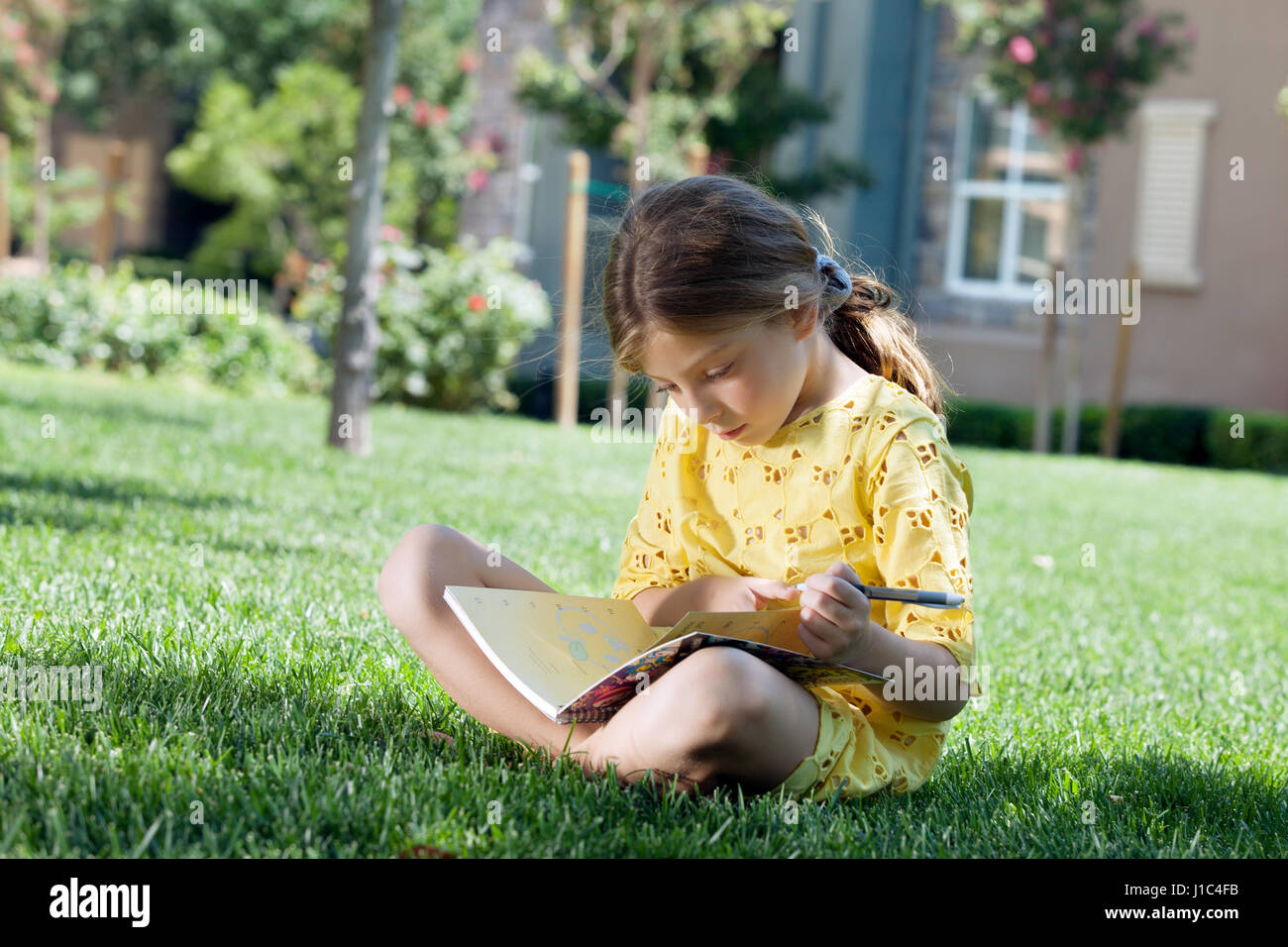 Child girl reading diary hi-res stock photography and images - Alamy