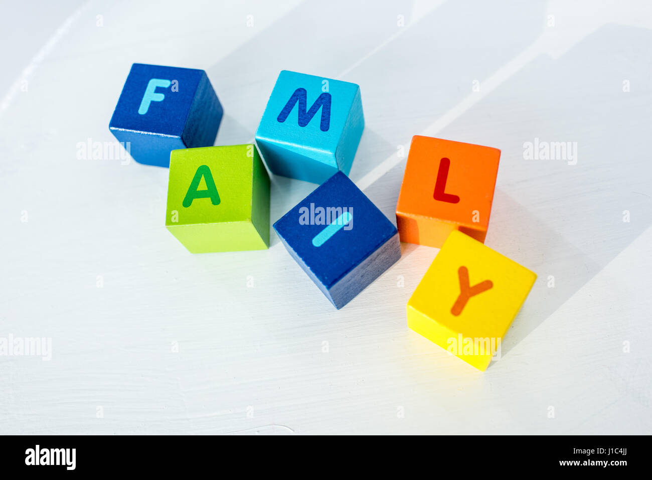 Colorful cubes with letters consists the word family on white Stock ...