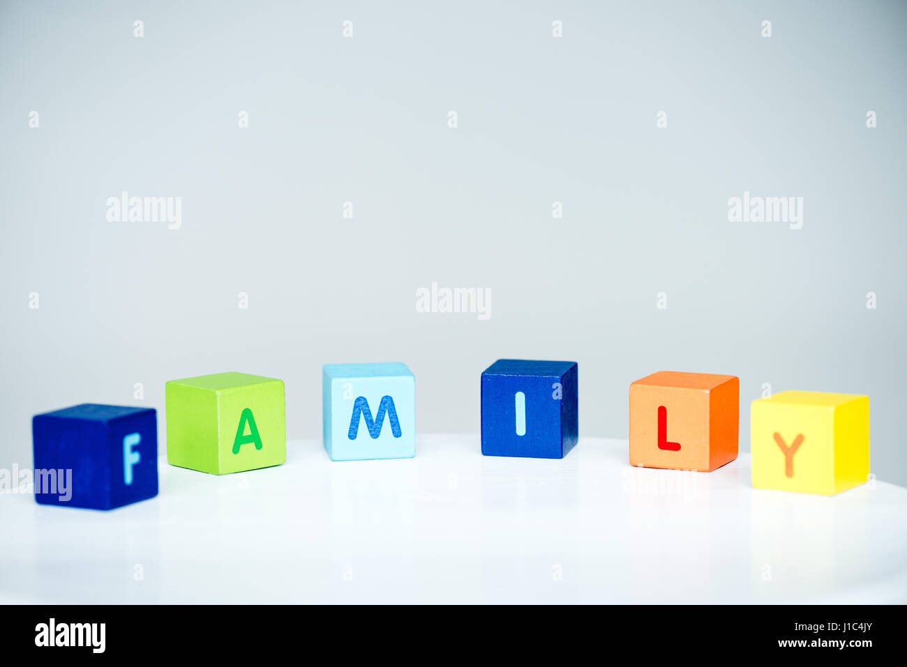 Colorful cubes with letters consists the word family on white Stock ...