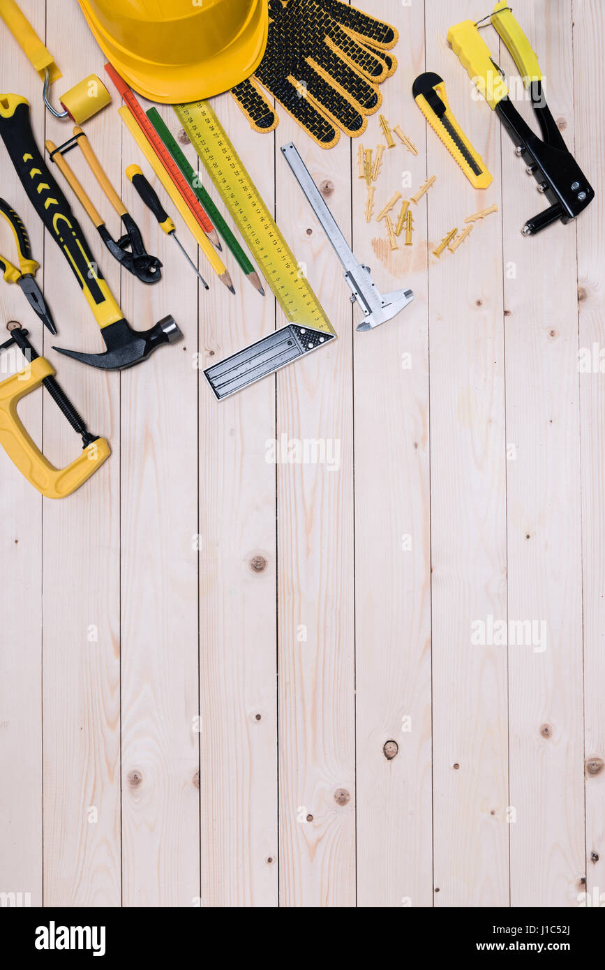 Top view of different tools on wooden tabletop with copy space Stock ...