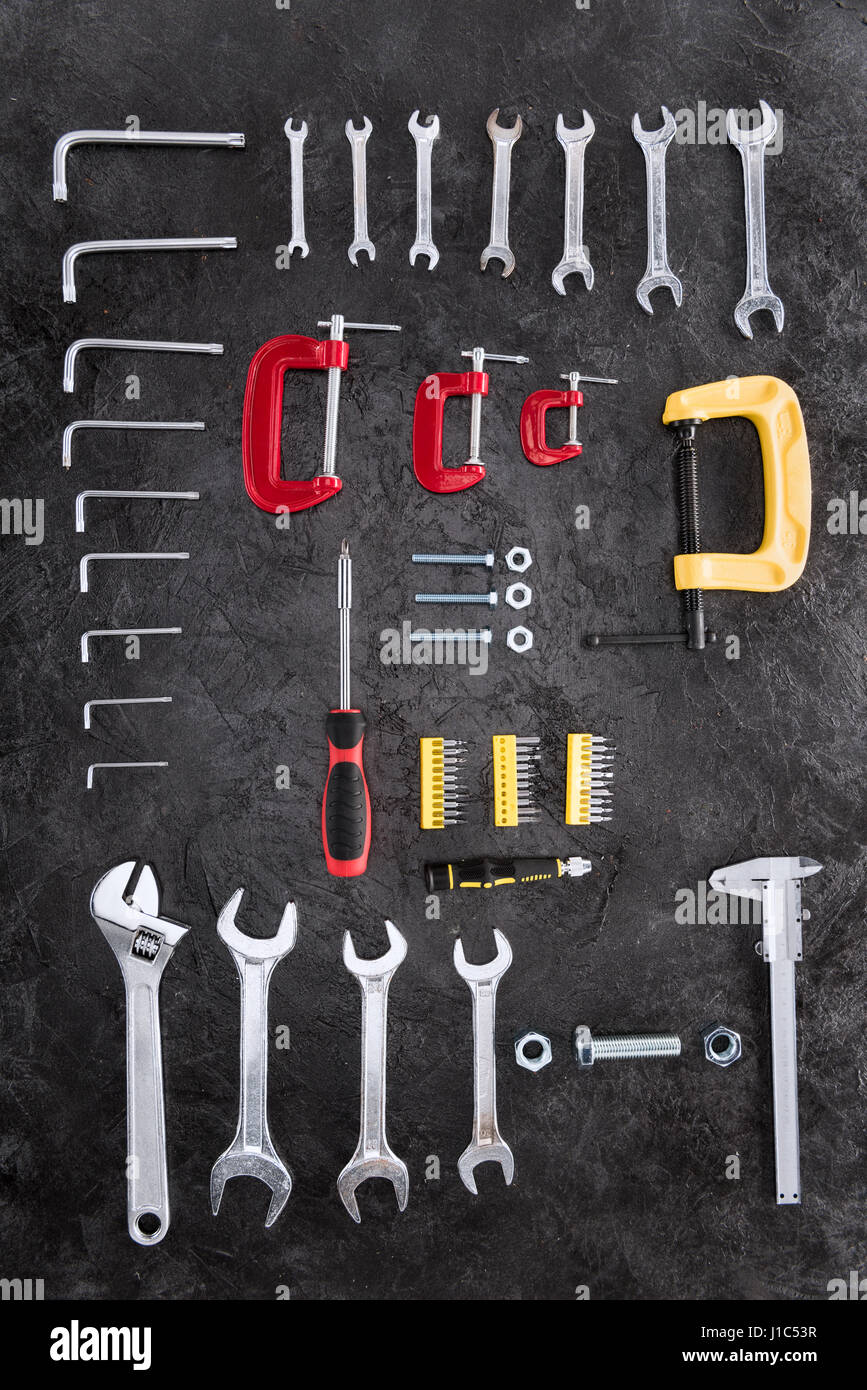 Top view of set of different construction tools on black Stock Photo ...