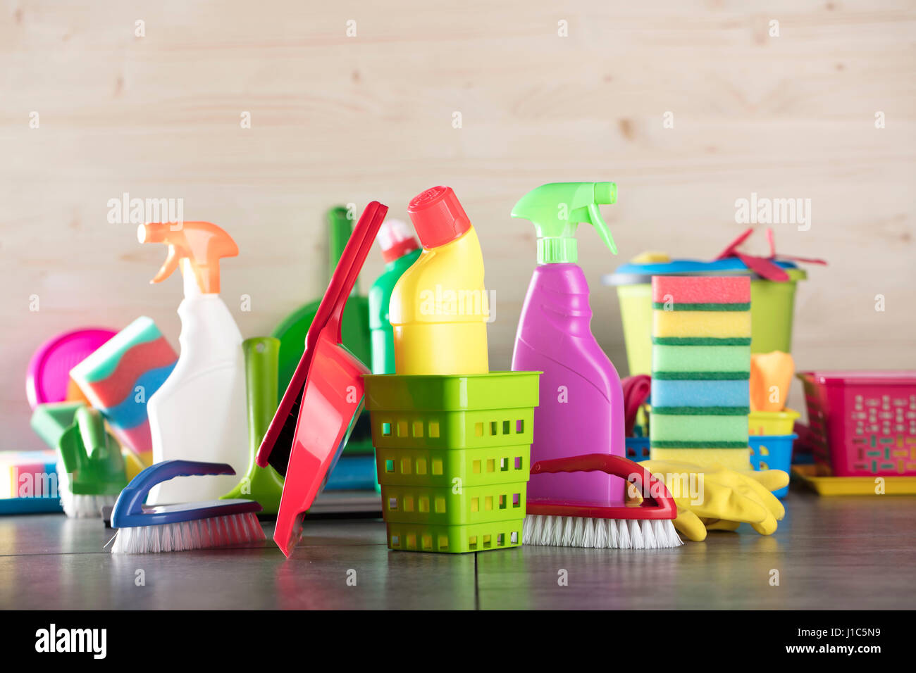 Spring cleanup theme. Variety of colorful house cleaning products on a ...