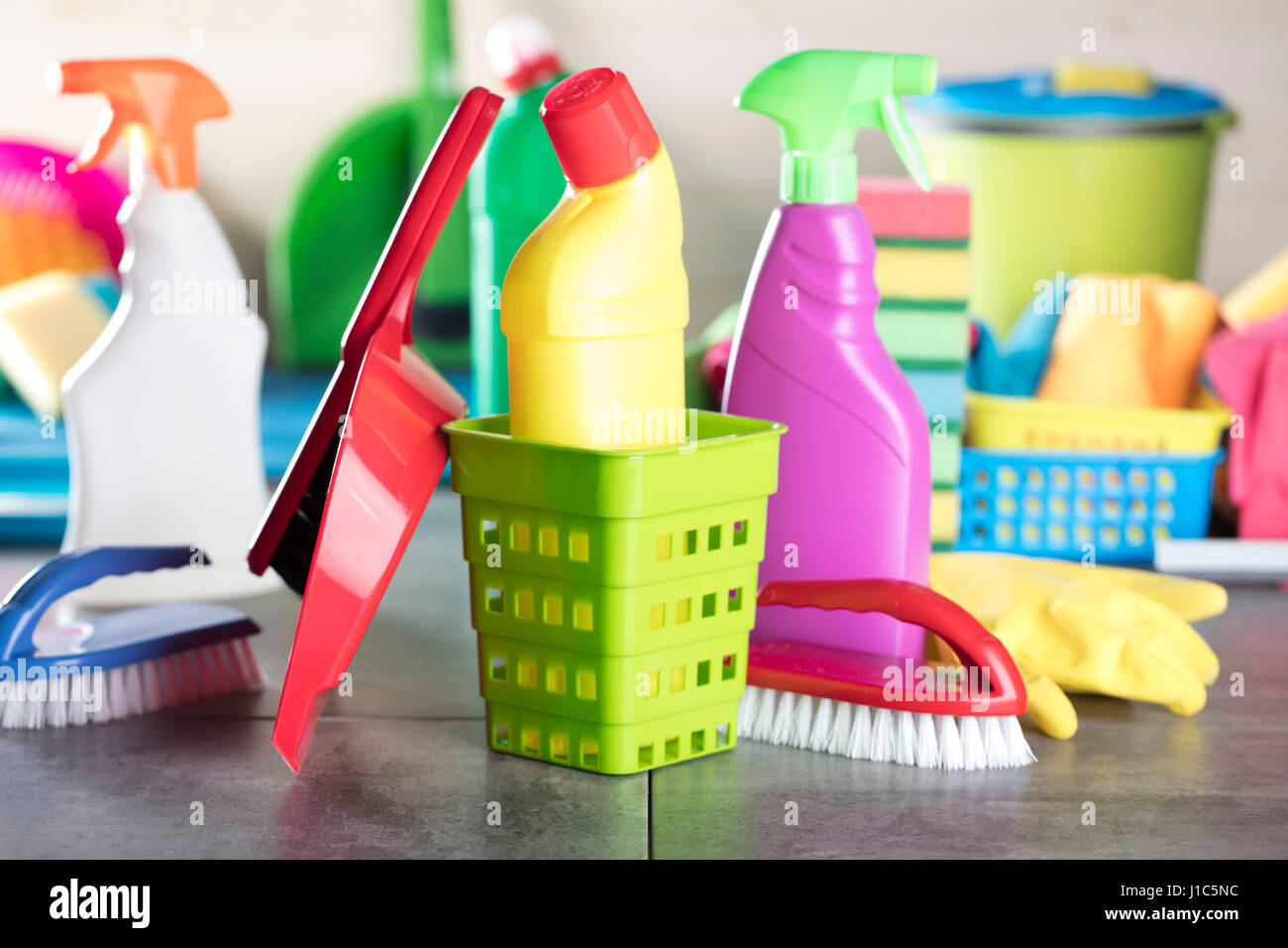 Spring cleanup theme. Variety of colorful house cleaning products on a ...