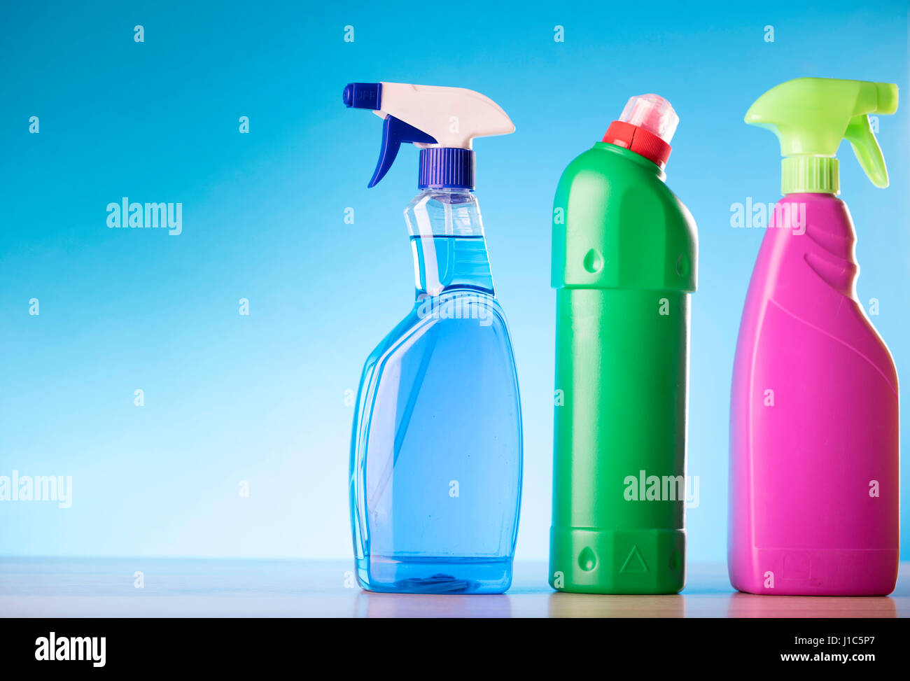 Spring cleanup theme. Variety of colorful house cleaning products on a ...