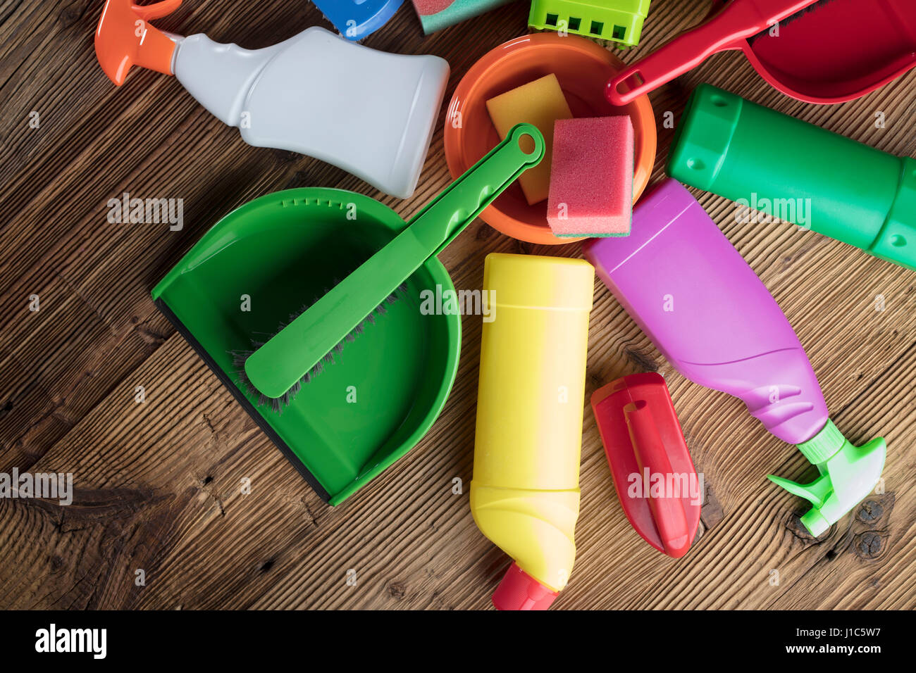 Spring cleanup theme. Variety of colorful house cleaning products on a ...