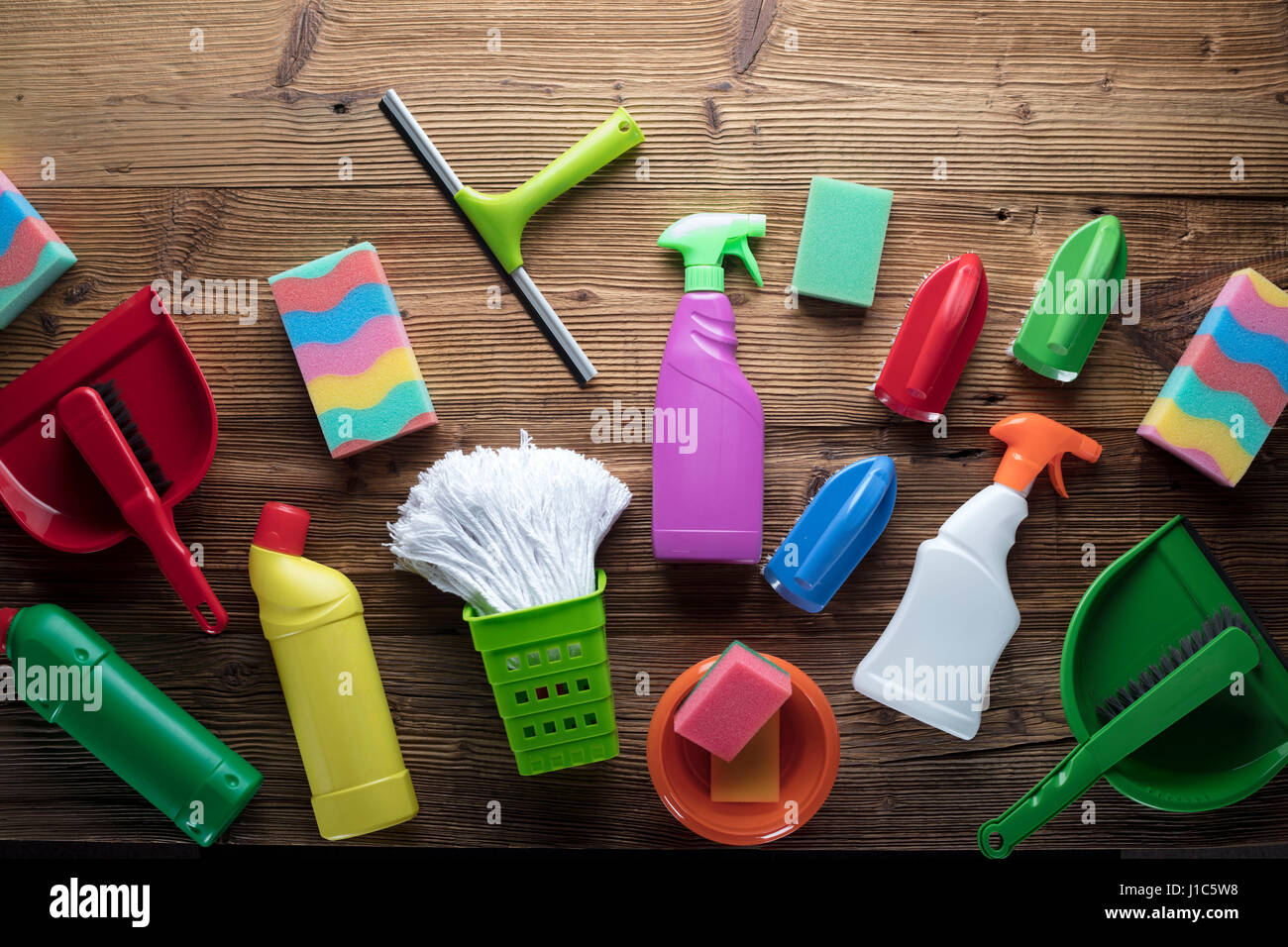 Spring cleanup theme. Variety of colorful house cleaning products on a ...