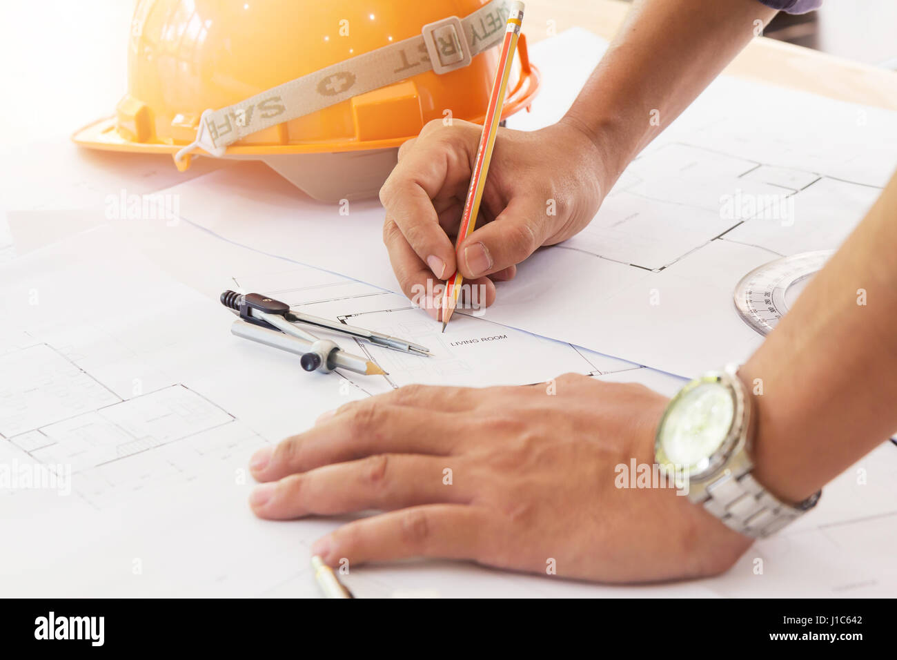 Architect concept, Architects working with blueprints in the office ...