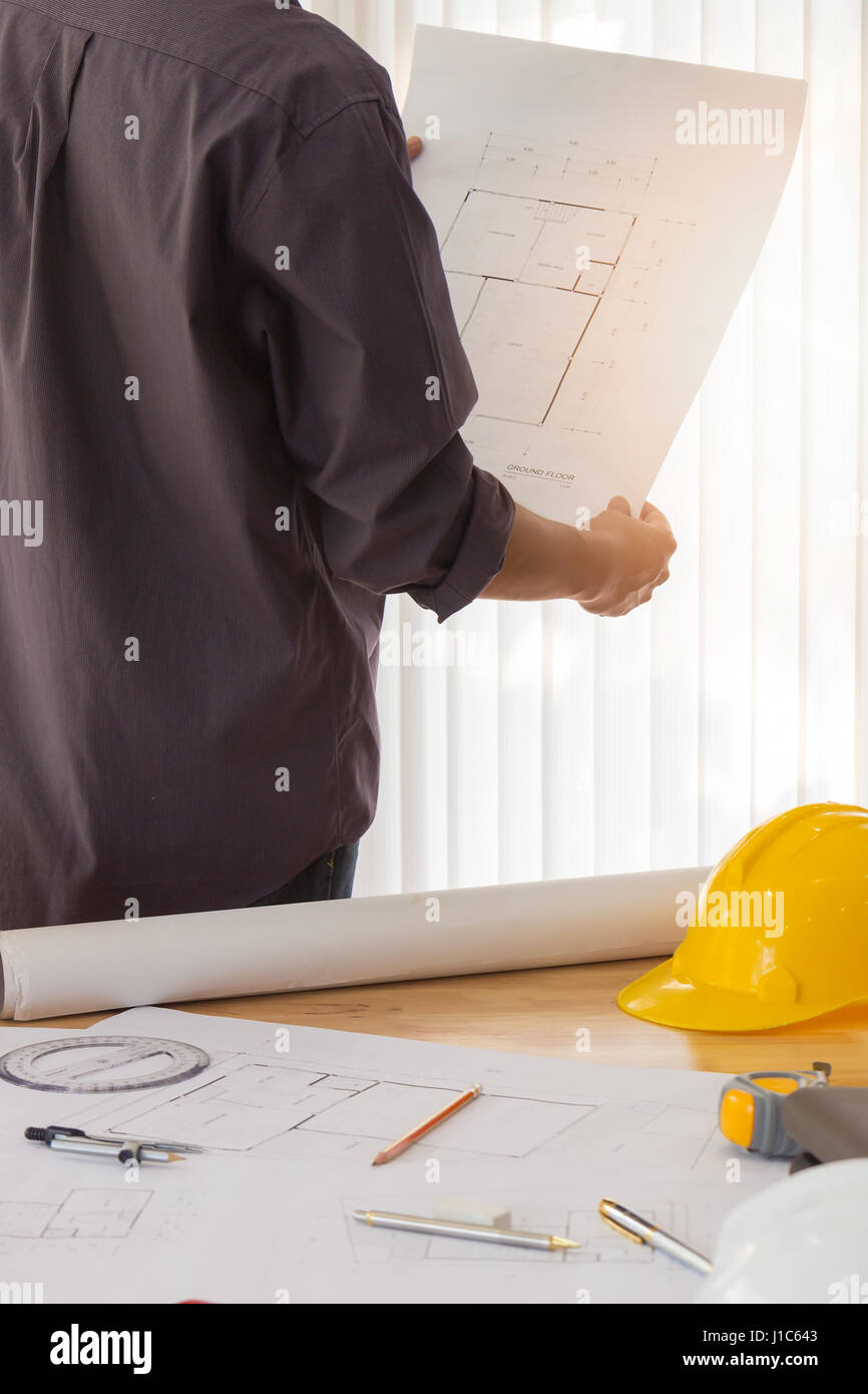 Architect concept, Architects working with blueprints in the office ...