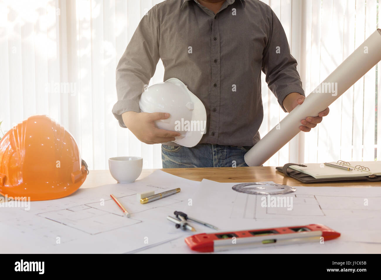 Architect concept, Architects working with blueprints in the office ...