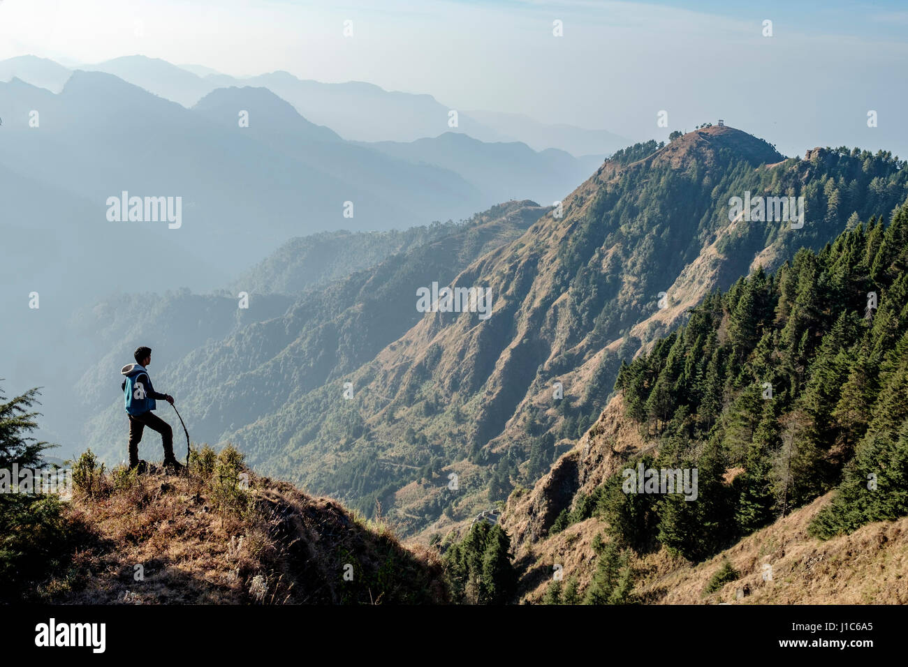 Indian man hiking on mountain Stock Photo - Alamy