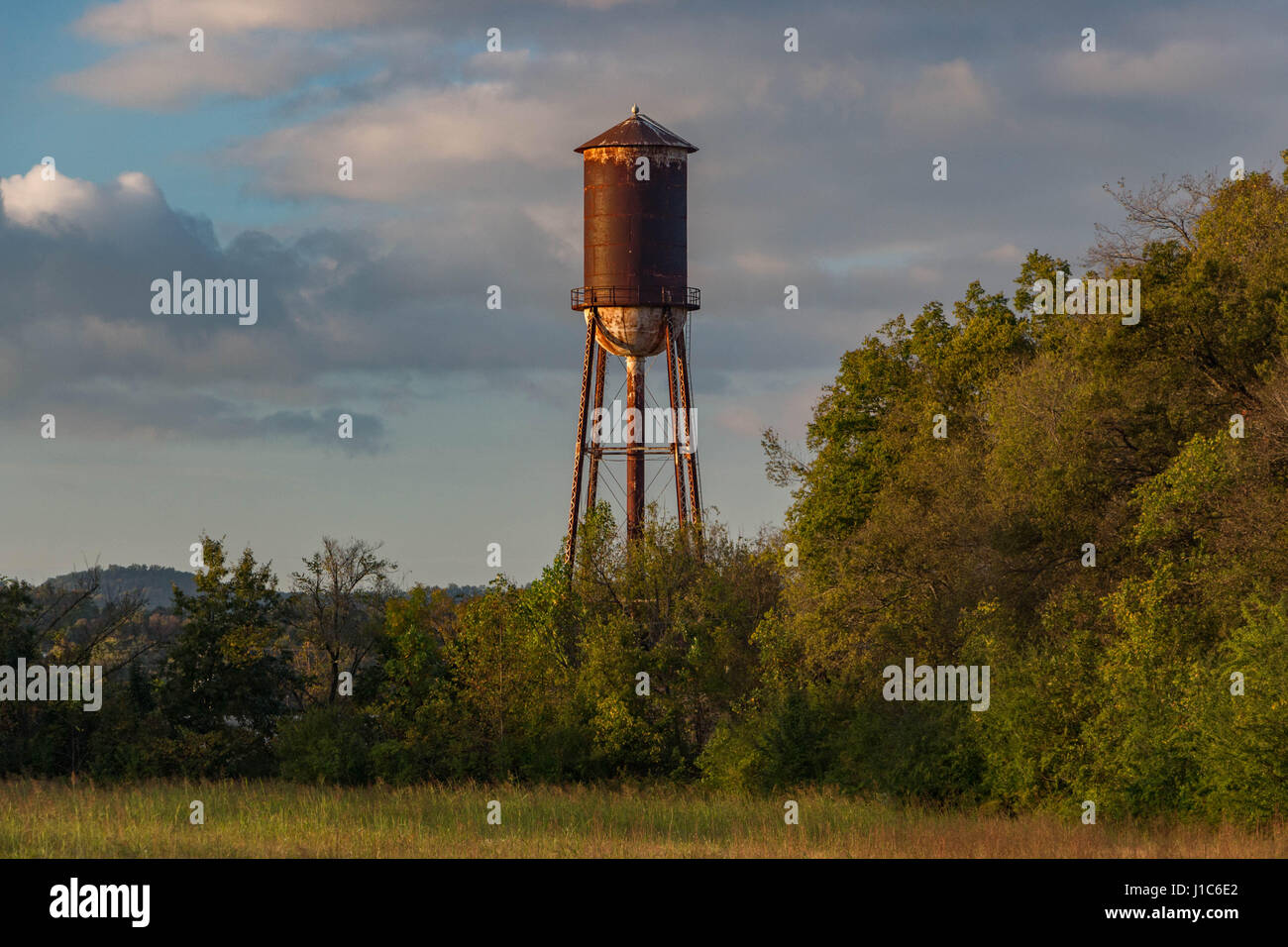 Old Rusty Water Tower at Sunset Stock Photo - Alamy