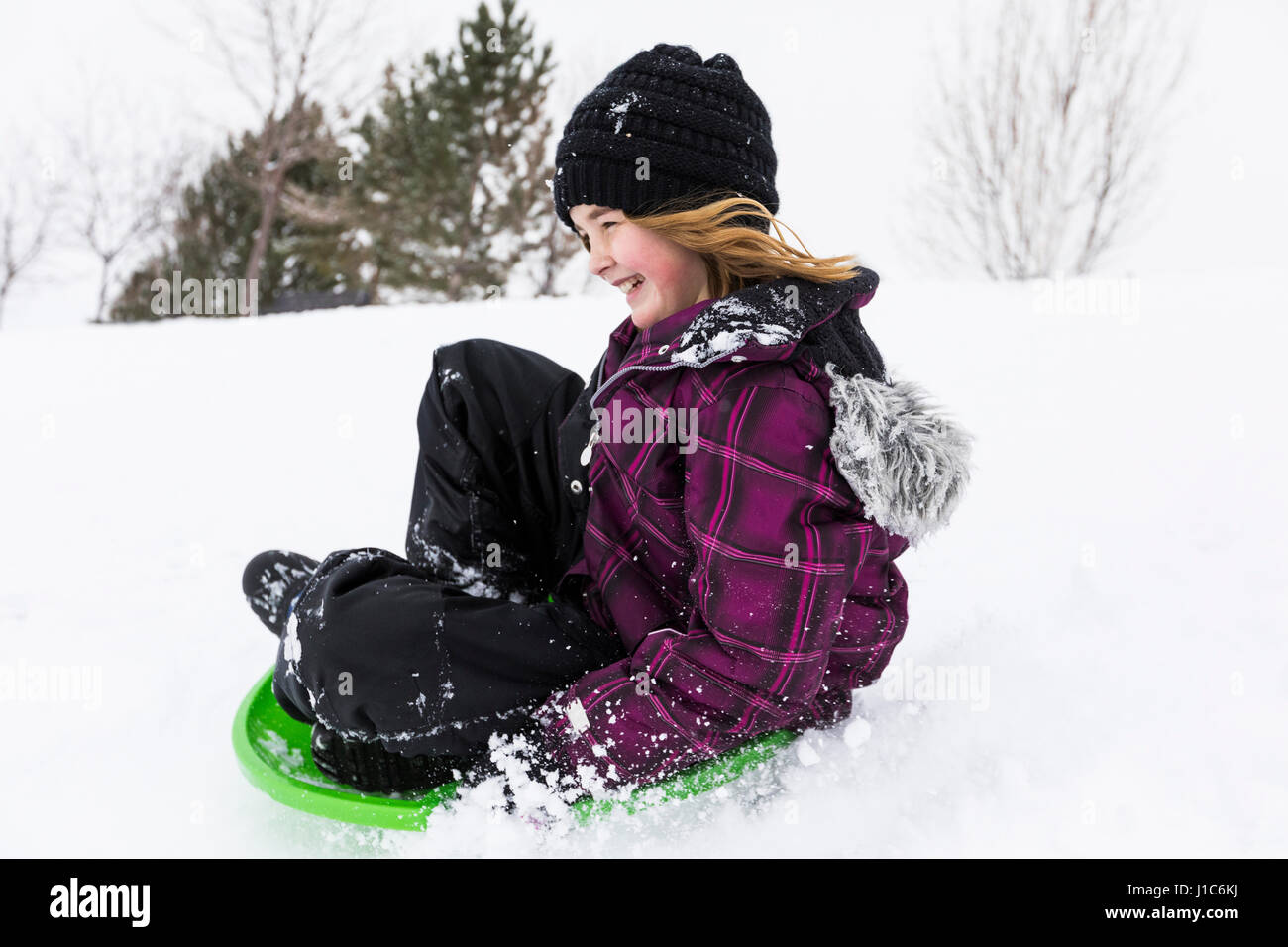 Sliding in the snow hi-res stock photography and images - Alamy