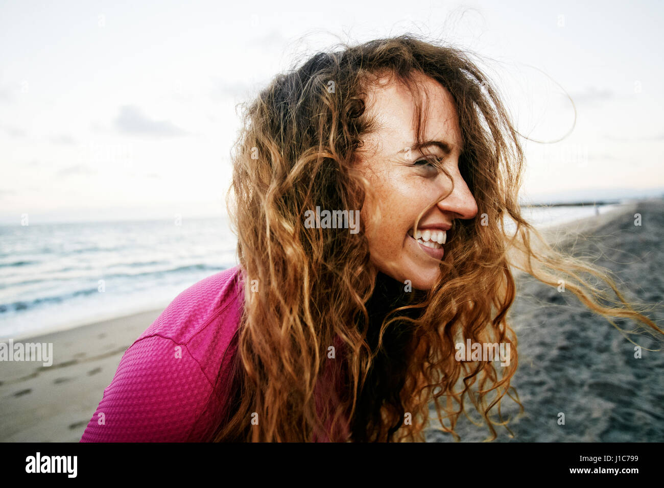 Wind blowing hair of Caucasian woman on beach Stock Photo - Alamy