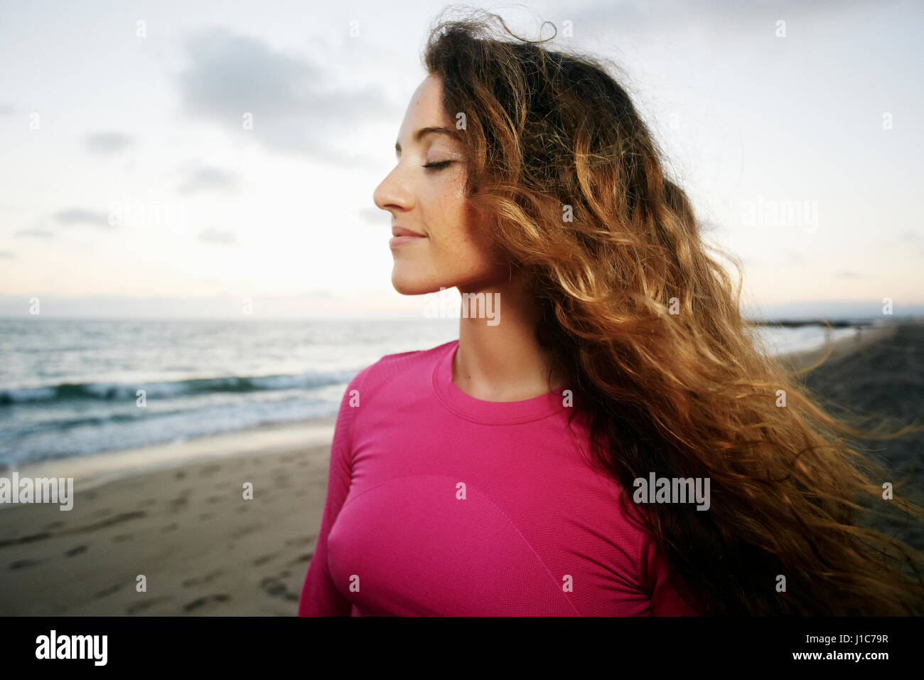 Wind blowing blonde hair woman beach hi-res stock photography and ...