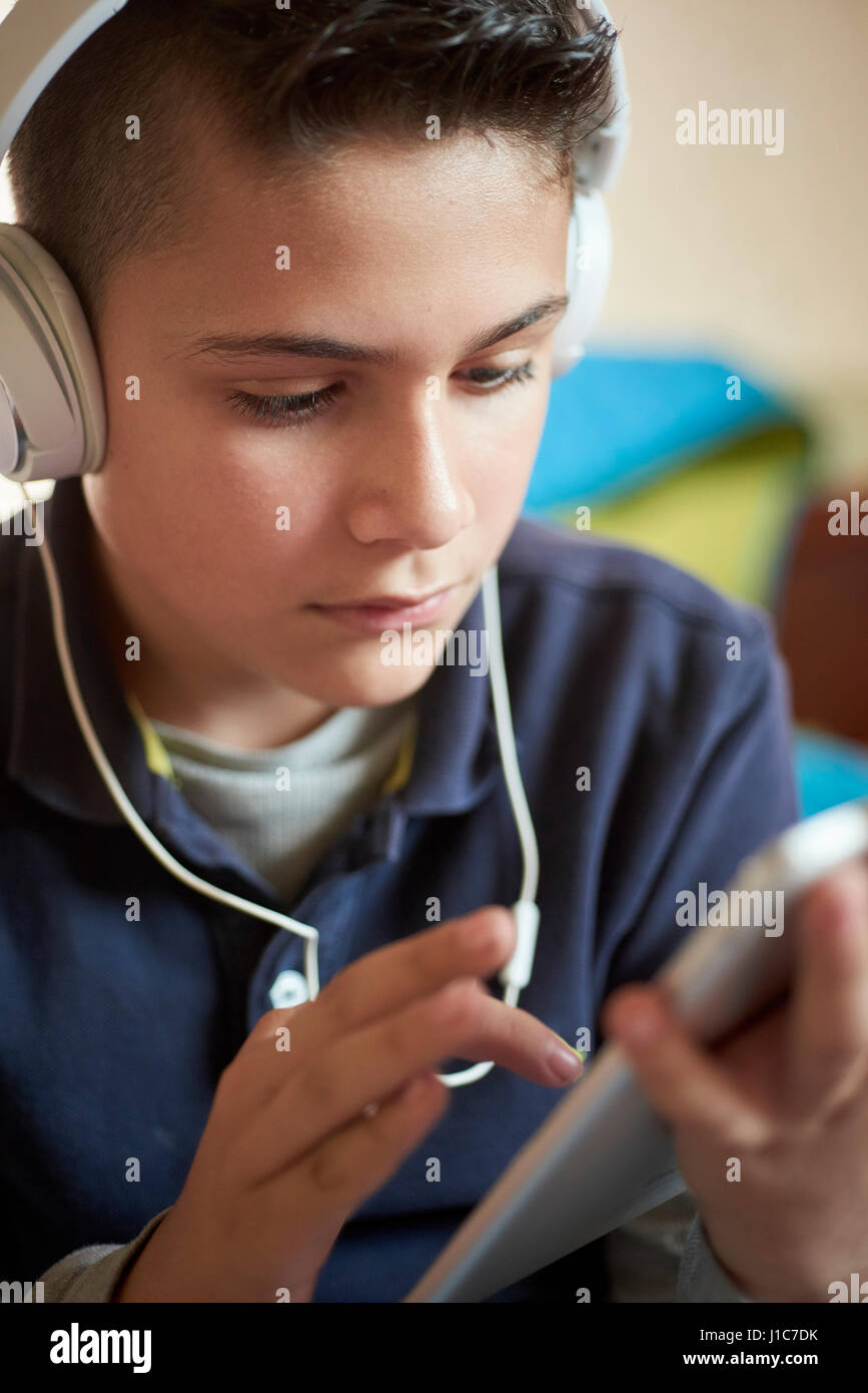 Boy using computer with headphones hi-res stock photography and images ...