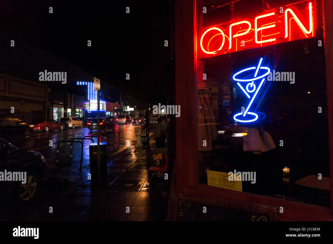 Neon sign in bar window at night Stock Photo - Alamy