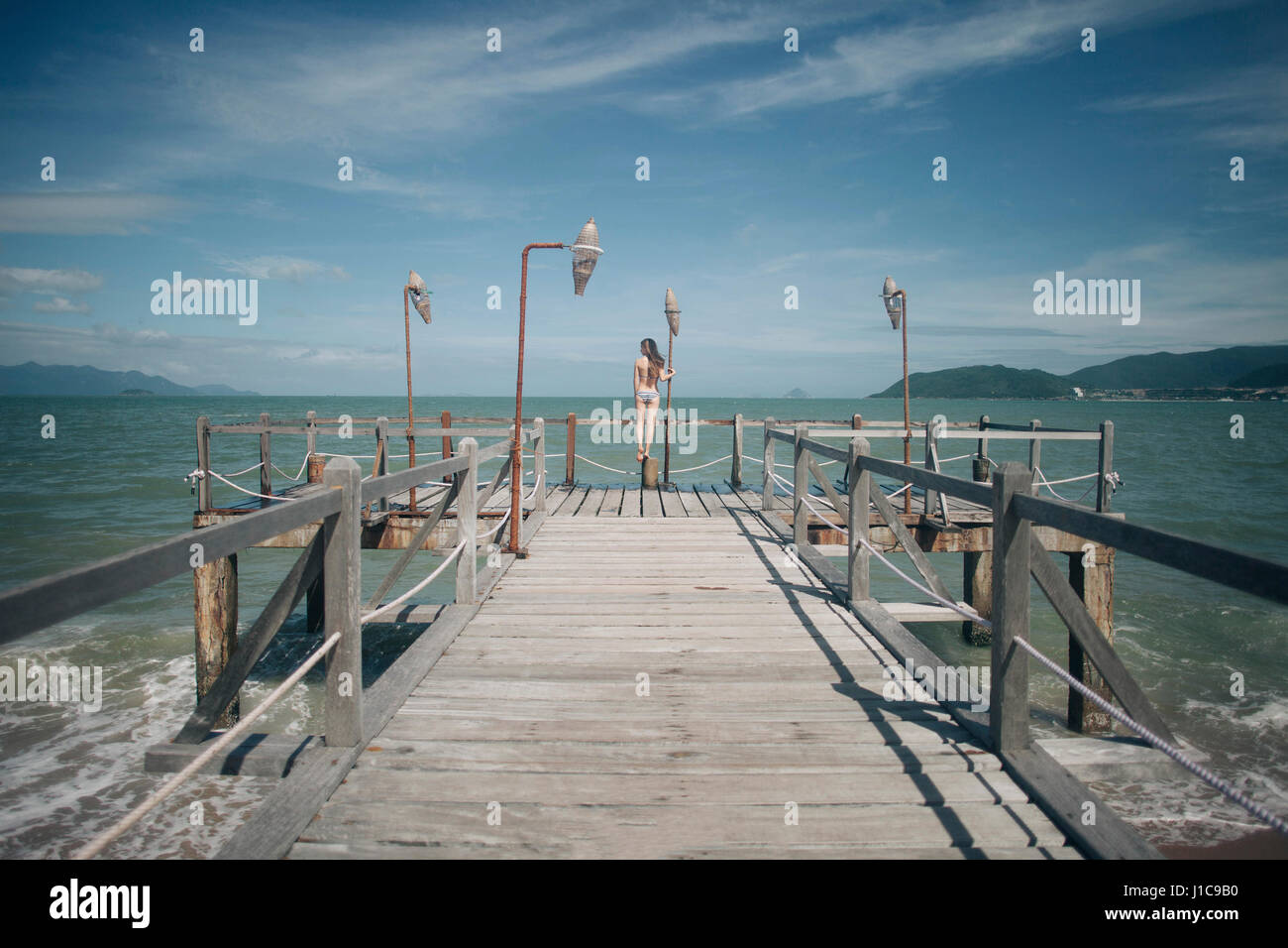 Full length woman standing railing hi-res stock photography and images ...
