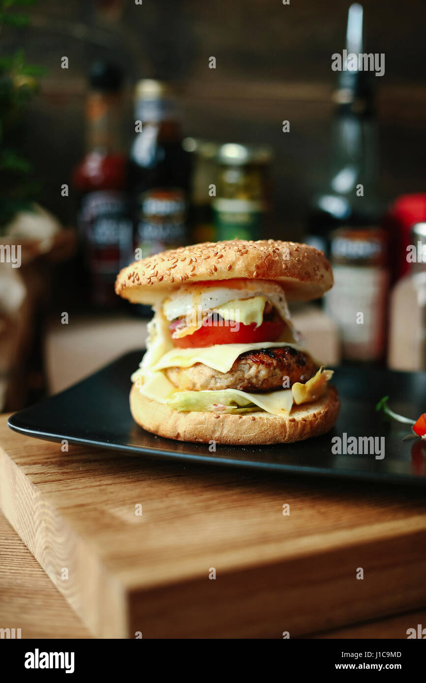 Gourmet cheeseburger on plate Stock Photo - Alamy