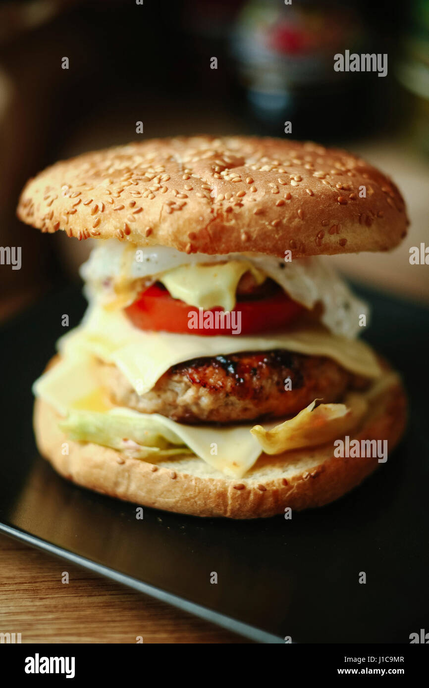 Gourmet cheeseburger on plate Stock Photo - Alamy