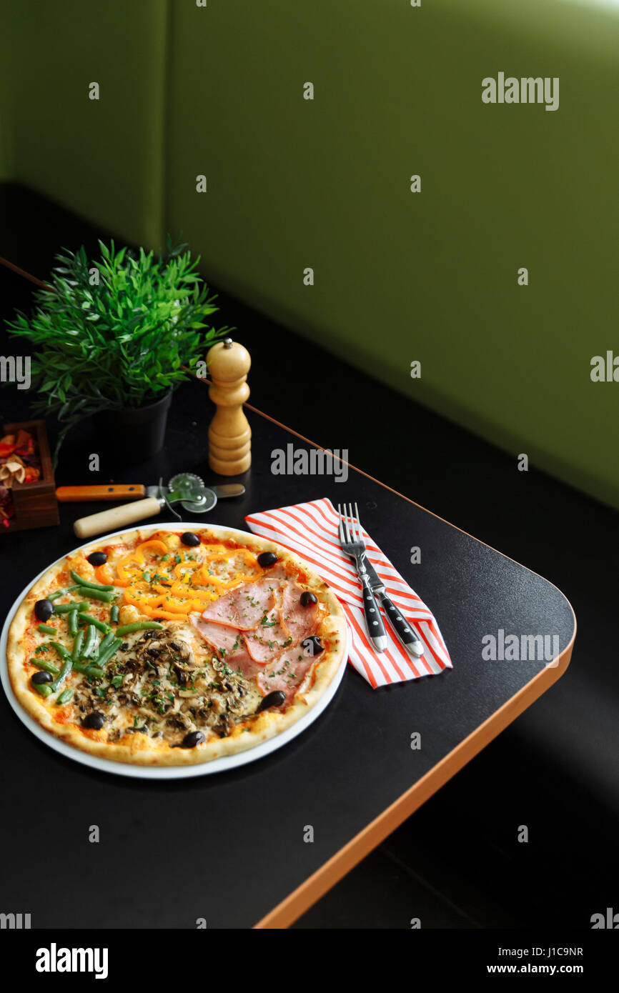 Gourmet pizza on plate Stock Photo - Alamy