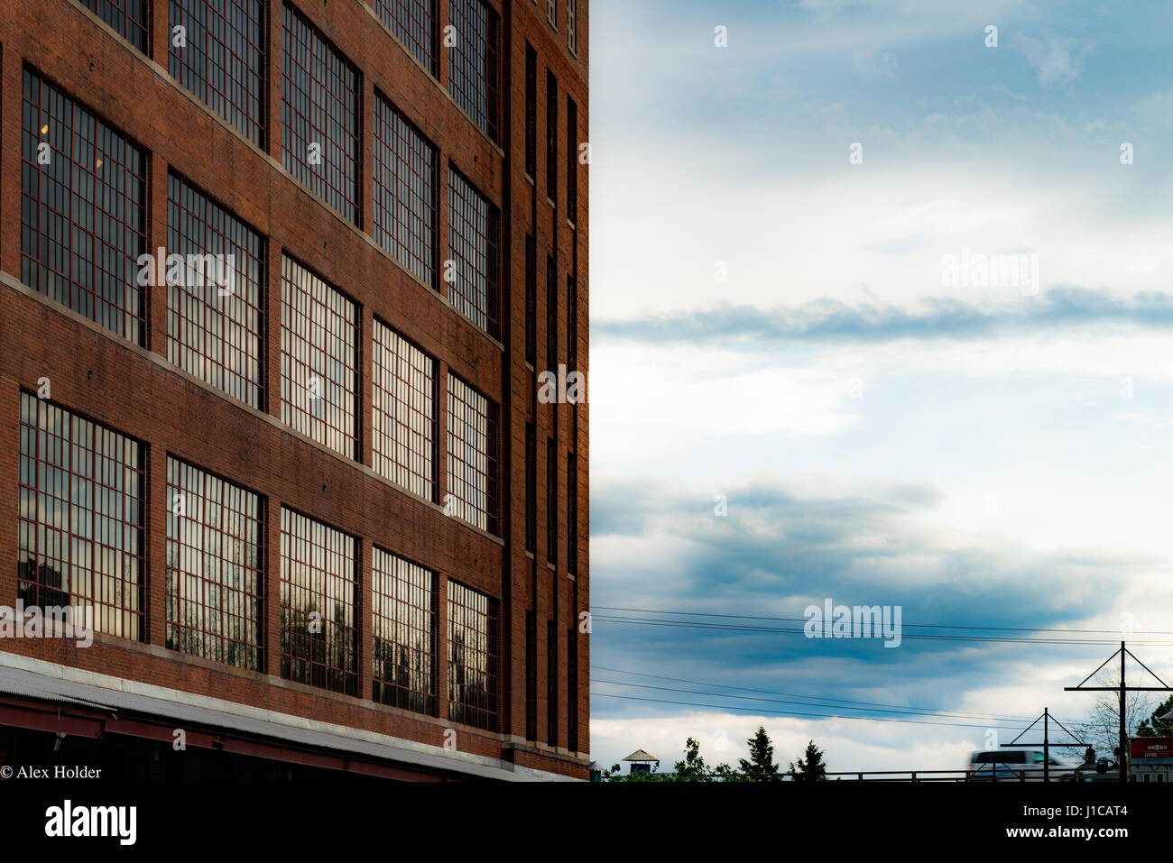 clouds reflect off a brick building Stock Photo - Alamy