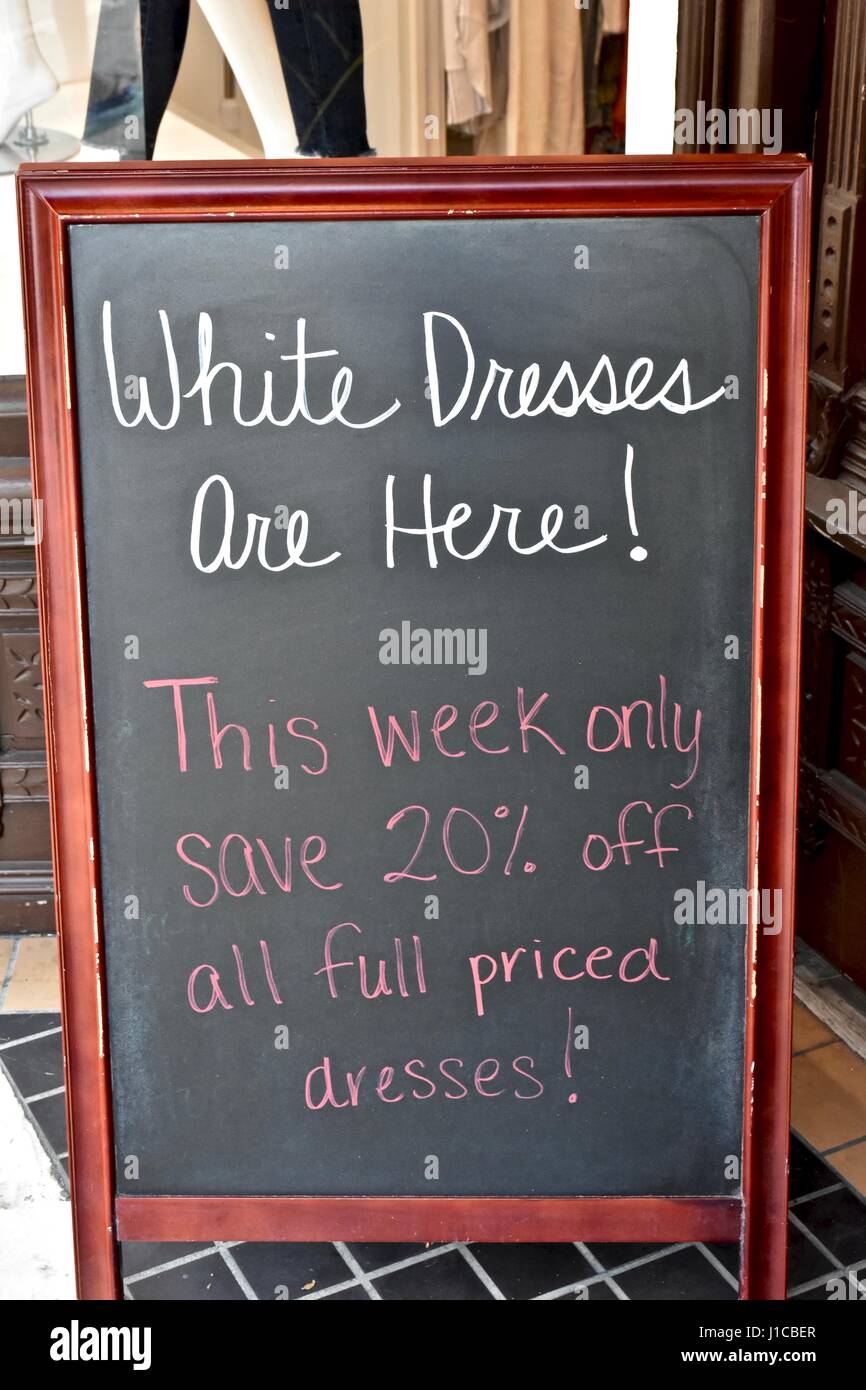 White dresses sign Stock Photo - Alamy
