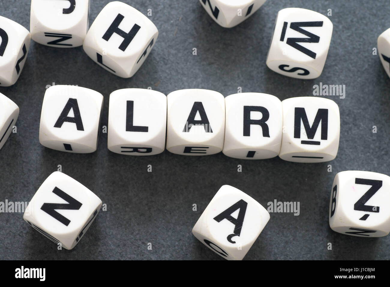 word alarm on white toy cubes Stock Photo - Alamy