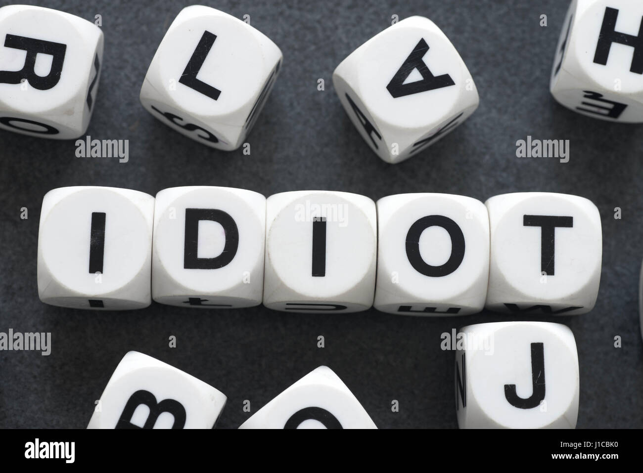 word idiot on white toy cubes Stock Photo - Alamy