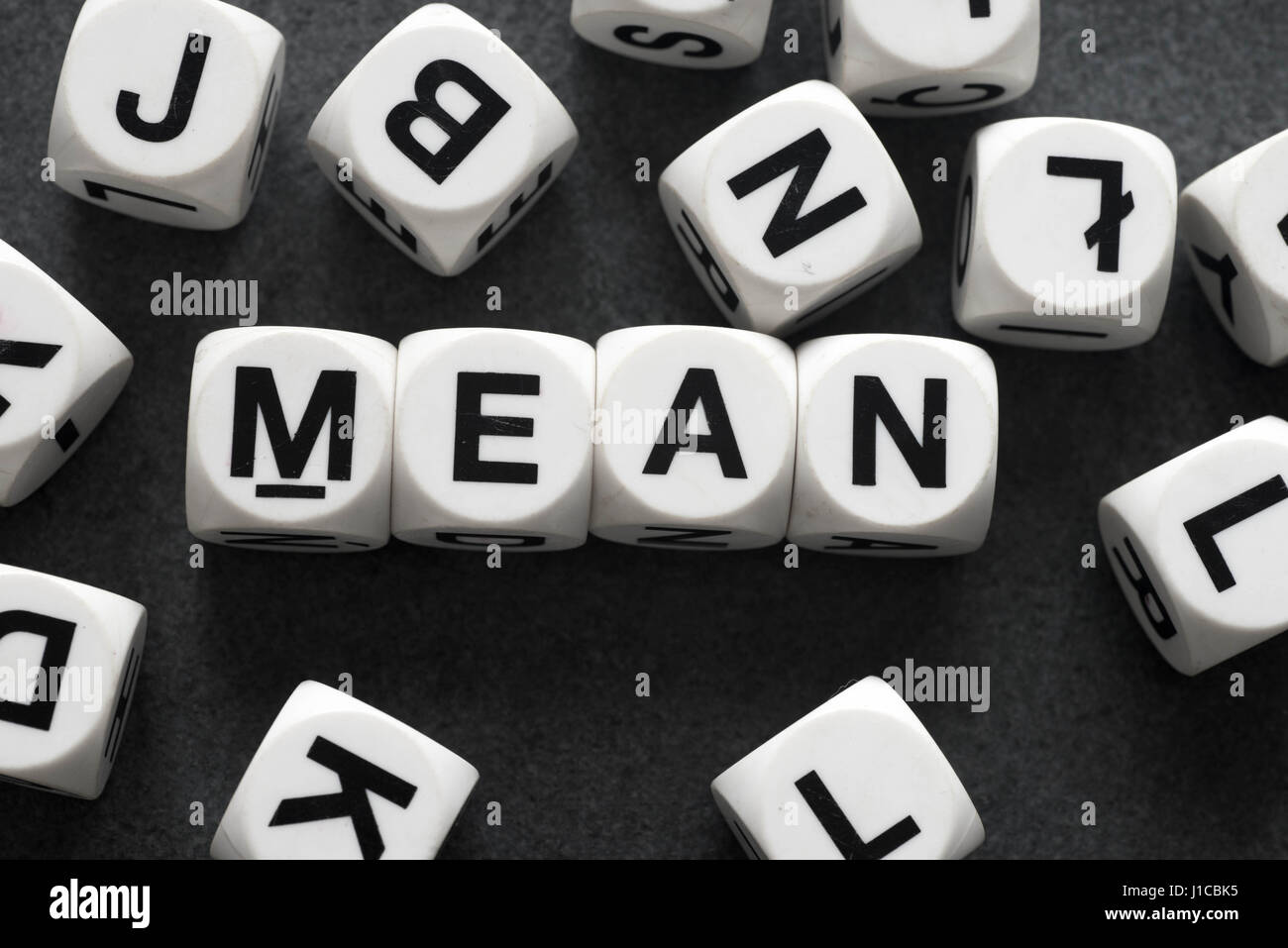 word mean on white toy cubes Stock Photo - Alamy