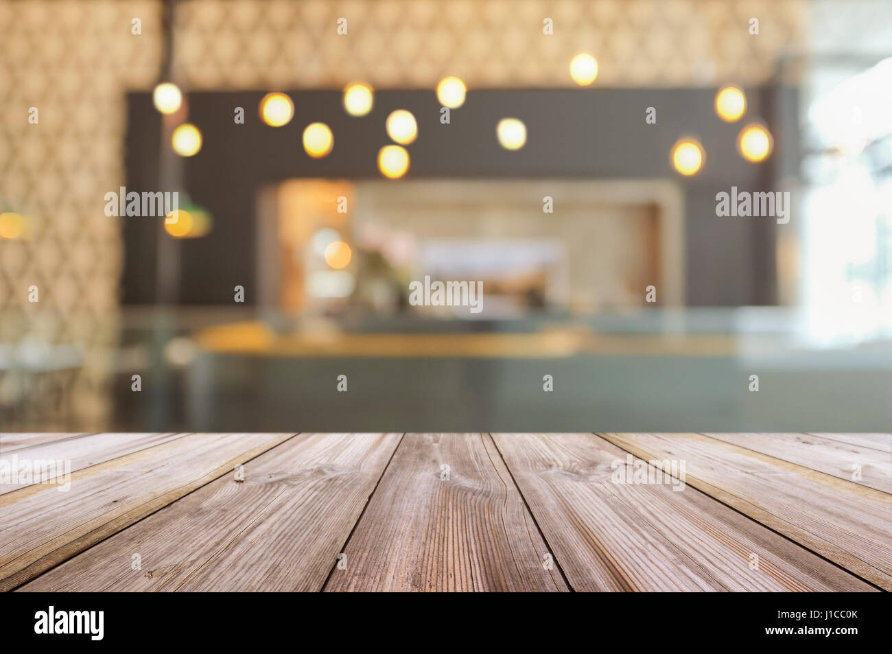 Empty wooden table top with blurred coffee shop interior background ...