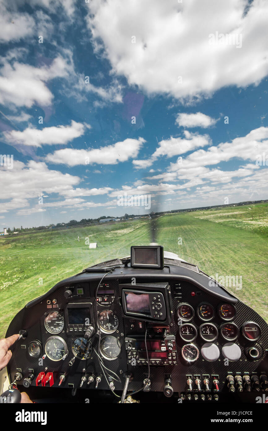 View from the pilot's seat in the cockpit of a light plane while ...