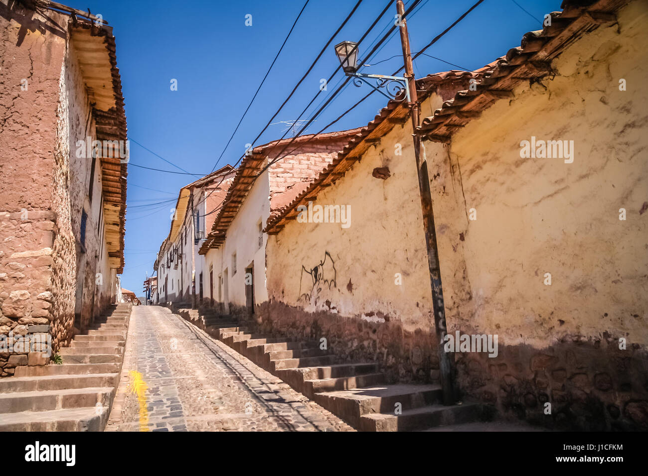 Steep street in the suburbs of Cusco, Peru Stock Photo - Alamy