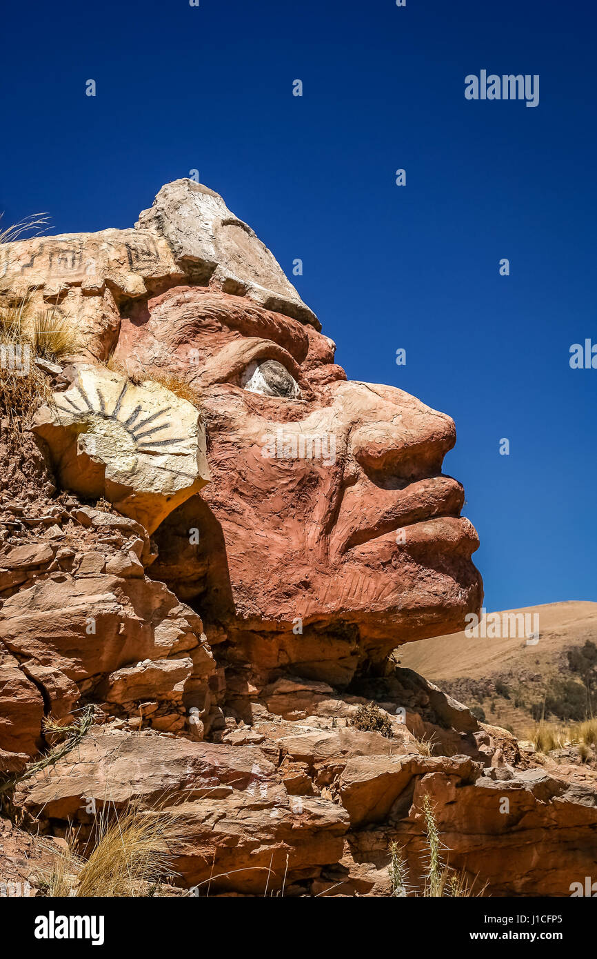 Stone Inca face sculpture on the shore of Lake Titicaca in Peru Stock ...