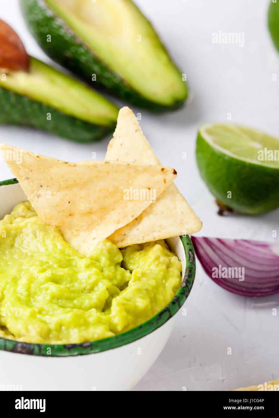 Mexican traditional guacamole in rustic white mug Stock Photo - Alamy