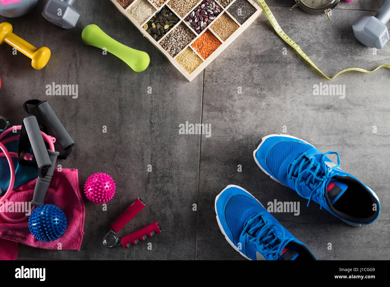 Fitness concept - objects and nutrition on glass floor and blue ...