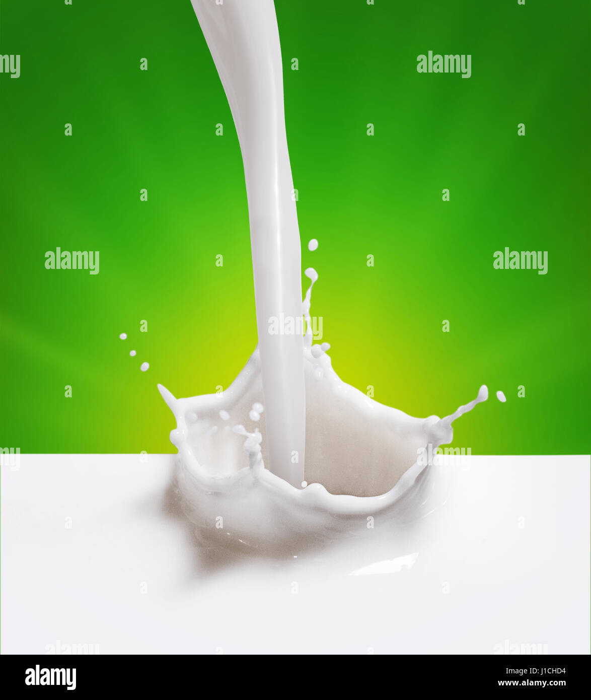 Organic Creamy Milk Splash Over Green Background Stock Photo - Alamy