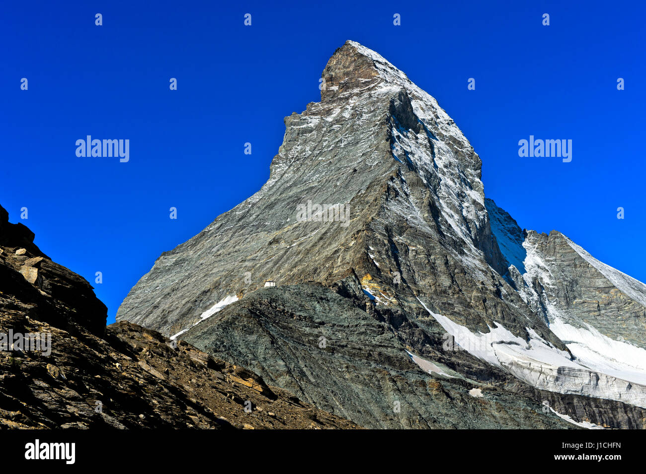 Mountain hut Hoernlihuette and Hoernli ridge at the Matterhorn peak ...