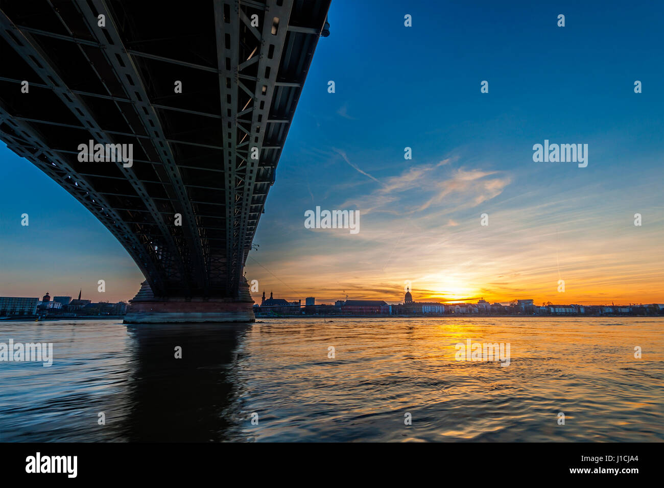 Beautiful sunset over Rhine / Rhein river and old bridge in Mainz near ...