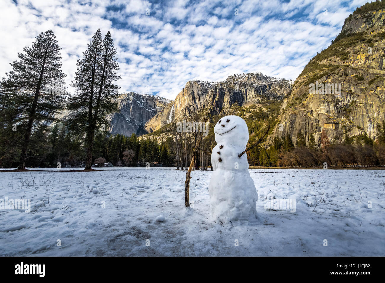 Snowman at Yosemite Valley during winter with Upper Yosemite Falls on ...