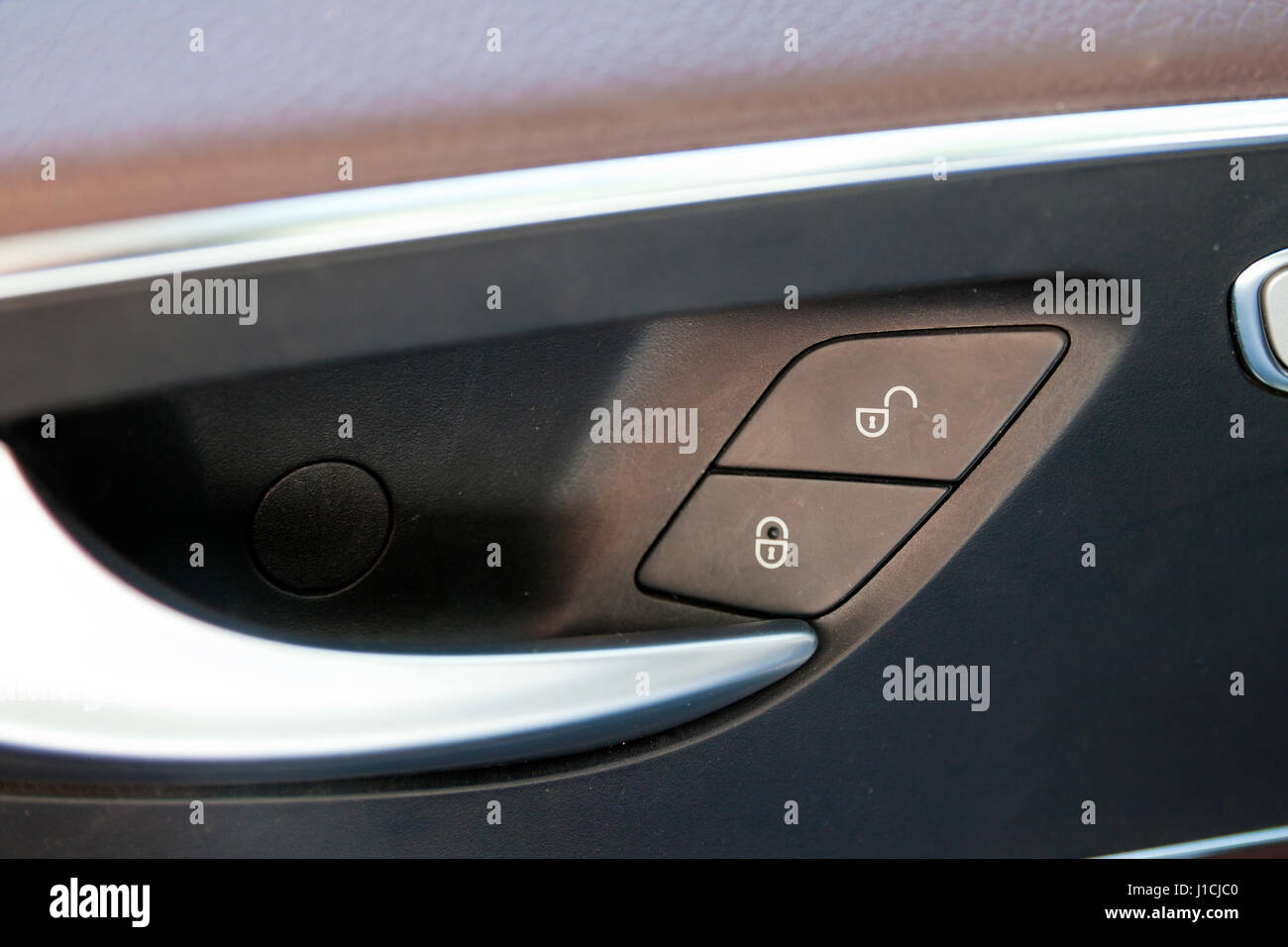 Door handle with close and open buttons in modern car interior Stock ...
