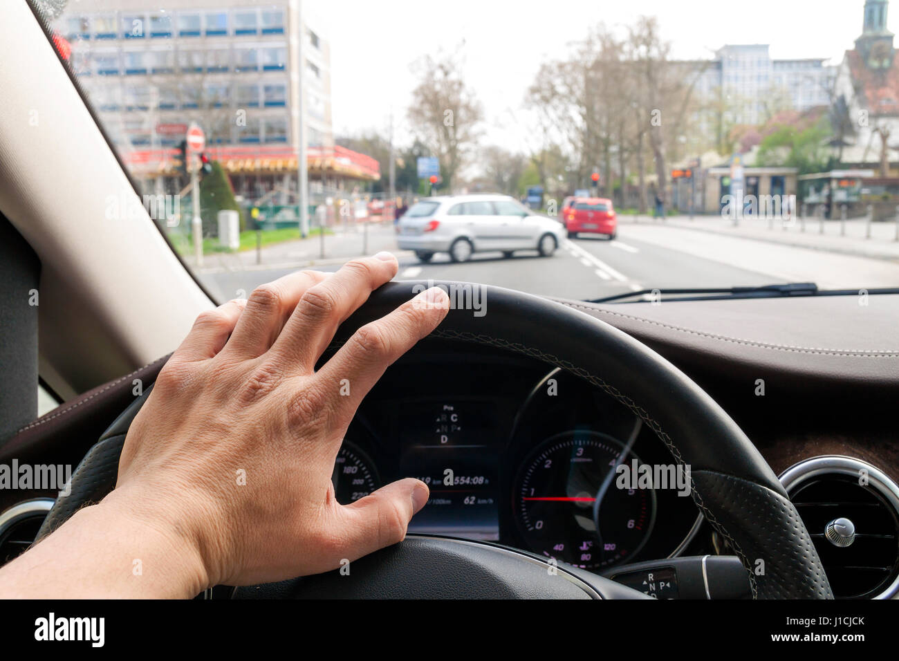 Drivers hand holding steering wheel hi-res stock photography and images ...