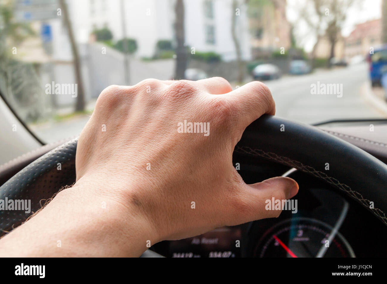 Drivers hand holding steering wheel hi-res stock photography and images ...