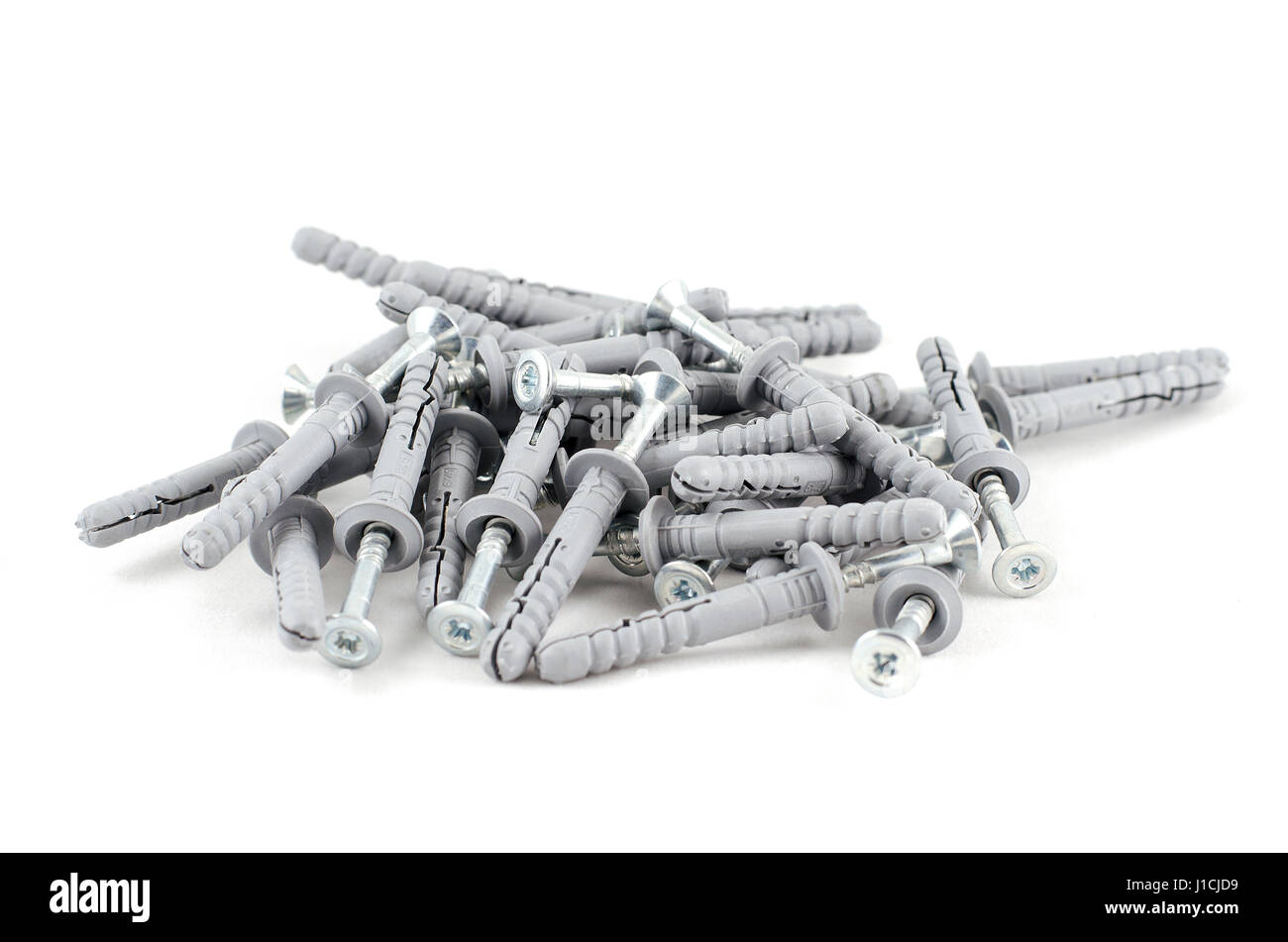 Metallic screws isolated over white background Stock Photo - Alamy