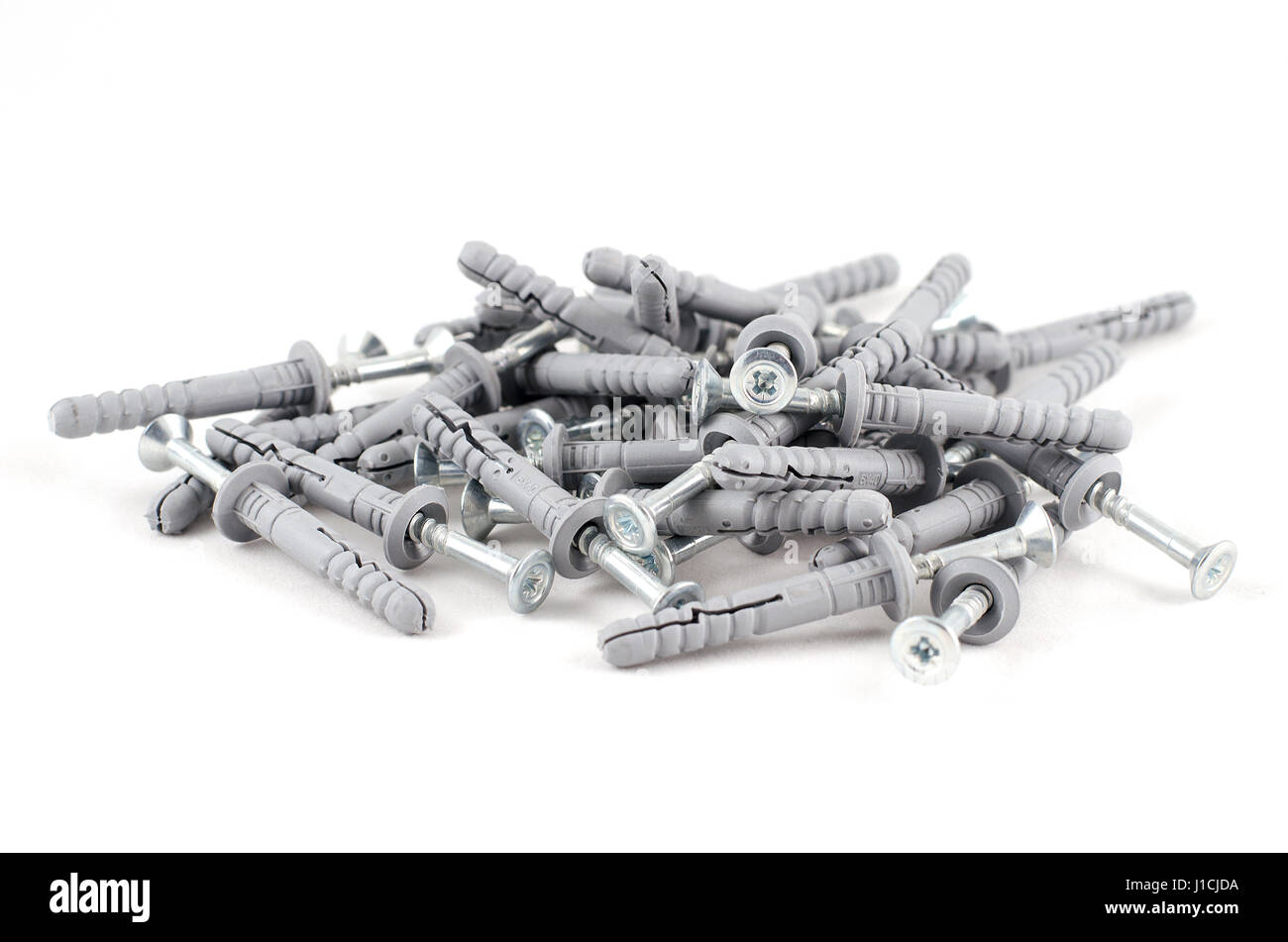 Metallic screws isolated over white background Stock Photo - Alamy