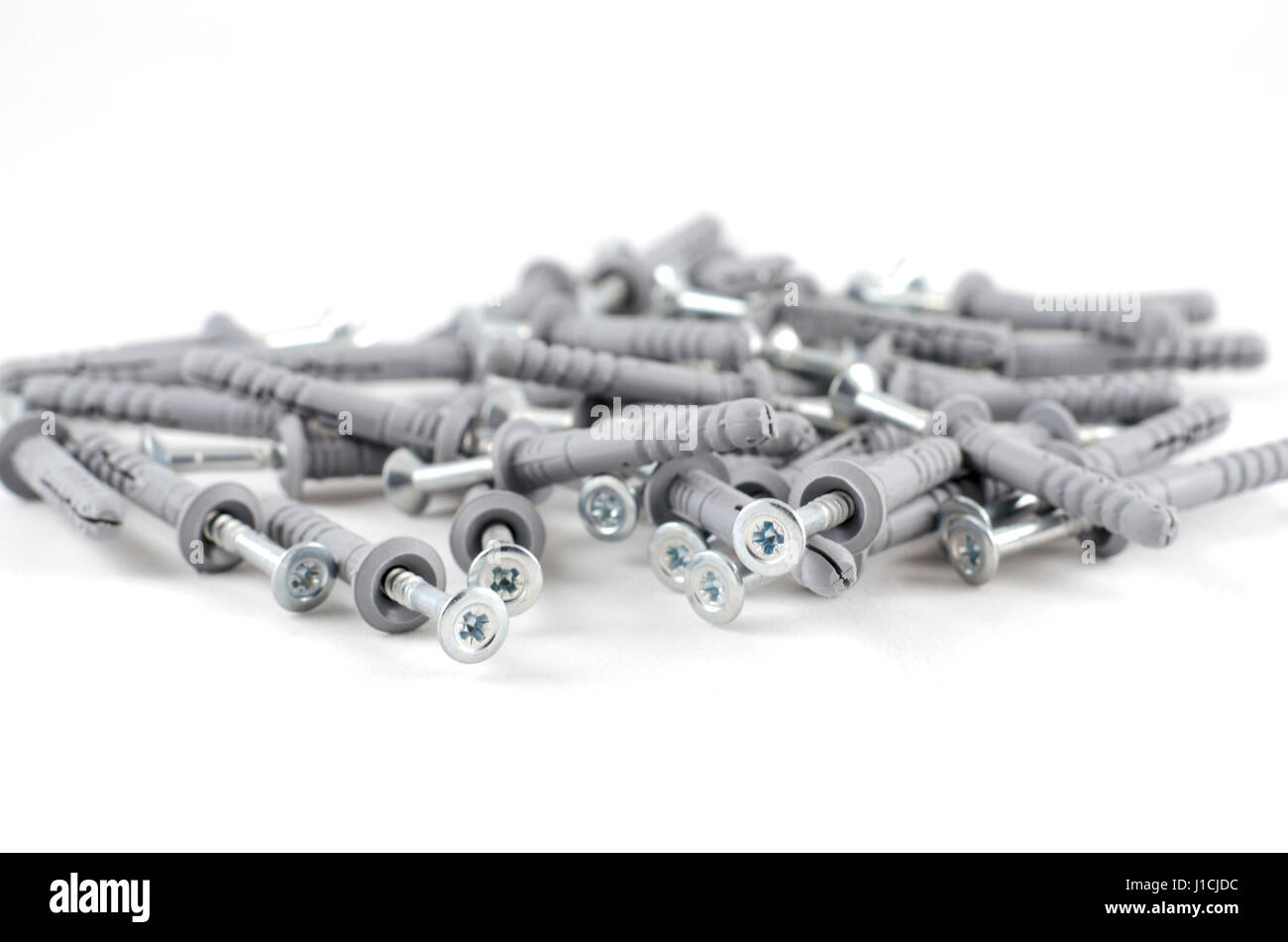 Metallic screws isolated over white background Stock Photo - Alamy