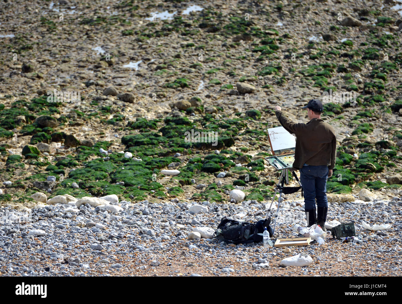 Artist painting the iconic Seven Sisters chalk cliffs in the South ...